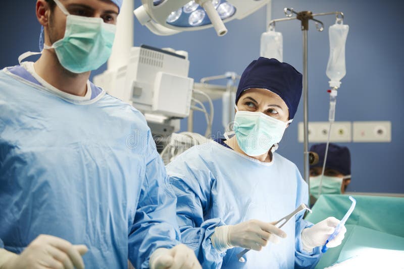 Surgeons Working Together while Operation Stock Photo - Image of ...