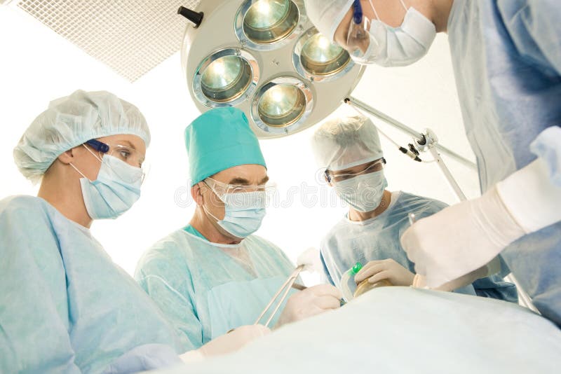 Operation Room with Medical Staff during Surgery Stock Image - Image of ...