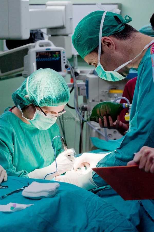 Surgery scene 12 stock photo. Image of instrument, group - 33913598