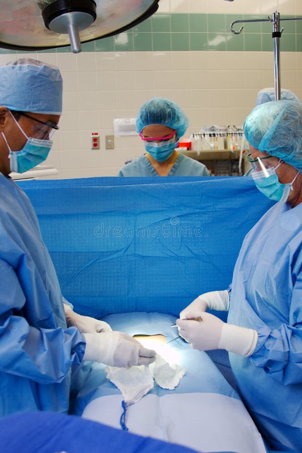 Surgery in progress stock photo. Image of surgeon, hospital - 35740520