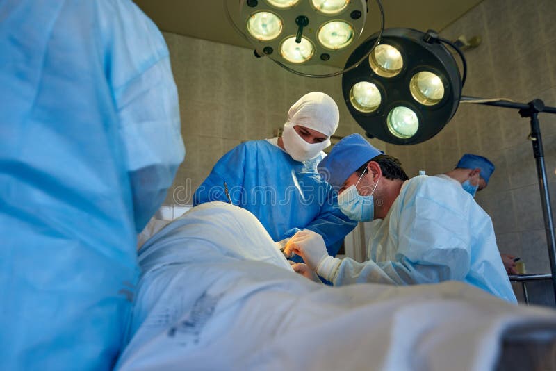 Surgery. Surgery in Progress. Surgeon and His Assistant. Medical ...