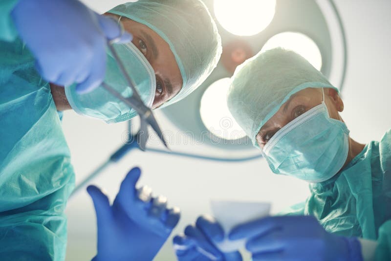 Surgery team stock image. Image of clinic, assisting - 46799097