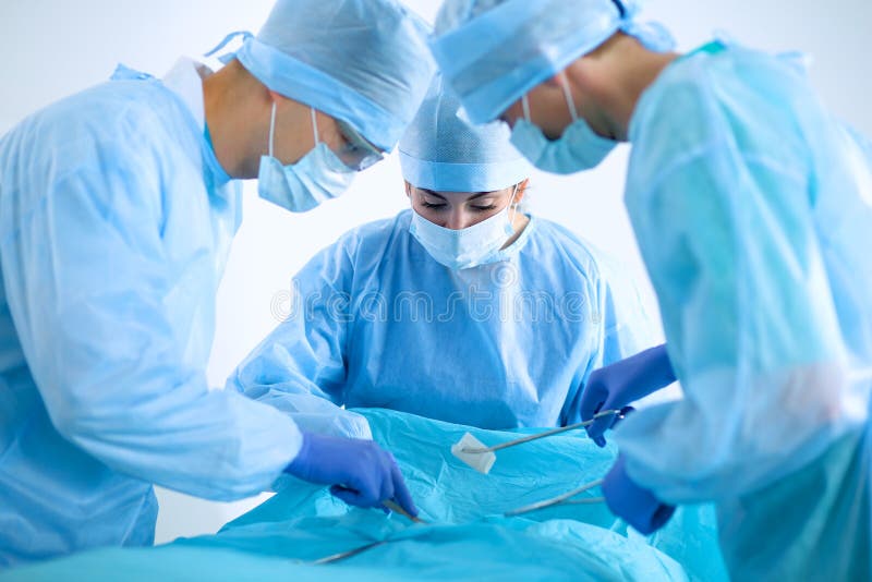 Multi-ethnic Surgeons during a Surgery Stock Image - Image of ailment ...