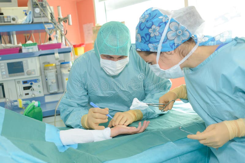 Surgery Team Operating in Surgical Room Stock Photo - Image of medicine ...