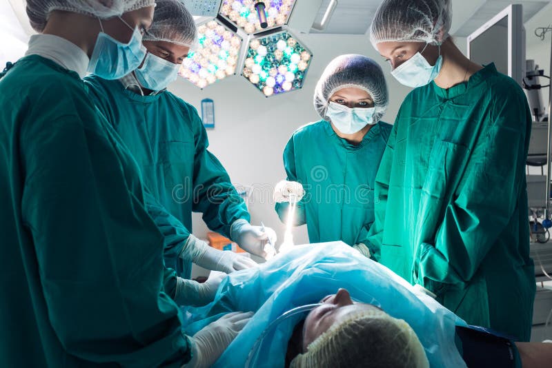 Medical Team in Operating Room Stock Photo - Image of crew, indoor ...