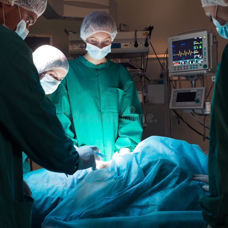 Multi-ethnic Surgeons during a Surgery Stock Image - Image of ailment ...