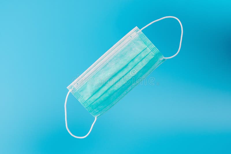 Surgical Face Mask on Blue Backdrop. Minimal Medical Concept Stock ...