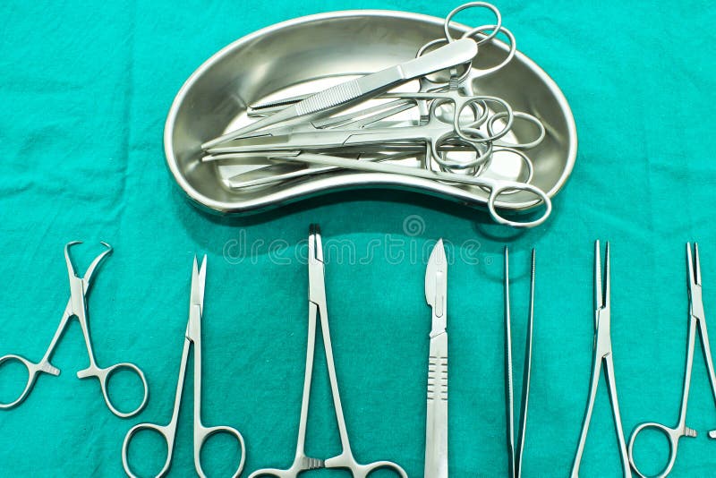 Surgical Instruments on the Green Fabric Background Stock Photo - Image ...