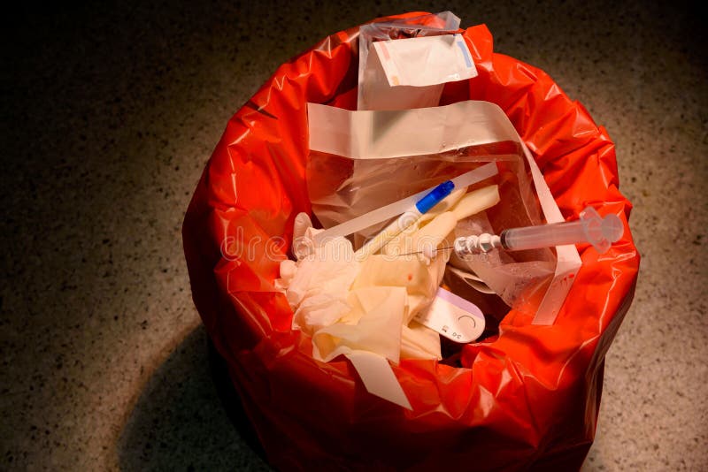 Surgical Instruments in Red Garbage Bin Stock Photo - Image of ...