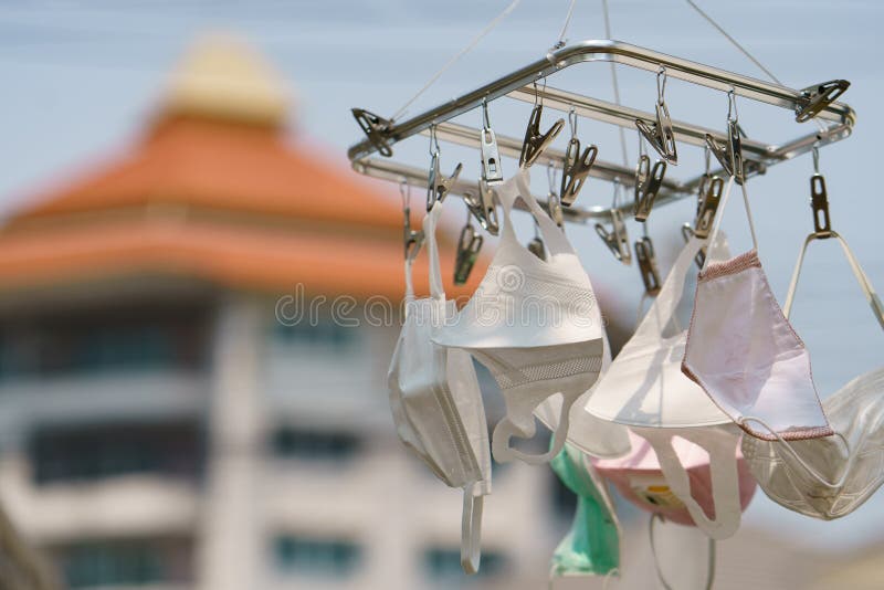Surgical Mask Hanging from a Drying Rack after Use and Wash. Concept ...