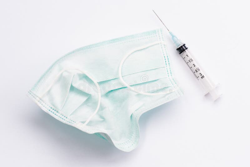 Surgical mask and syringe stock image. Image of surgical - 10831349