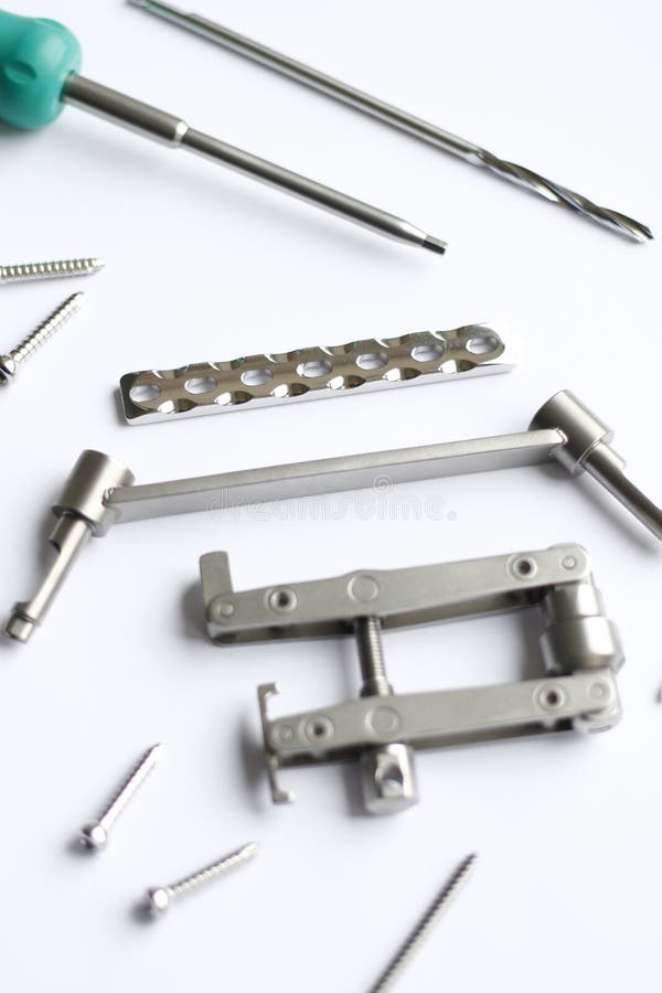 Surgical Plates and Screws for Operation in Traumatology Stock Photo ...