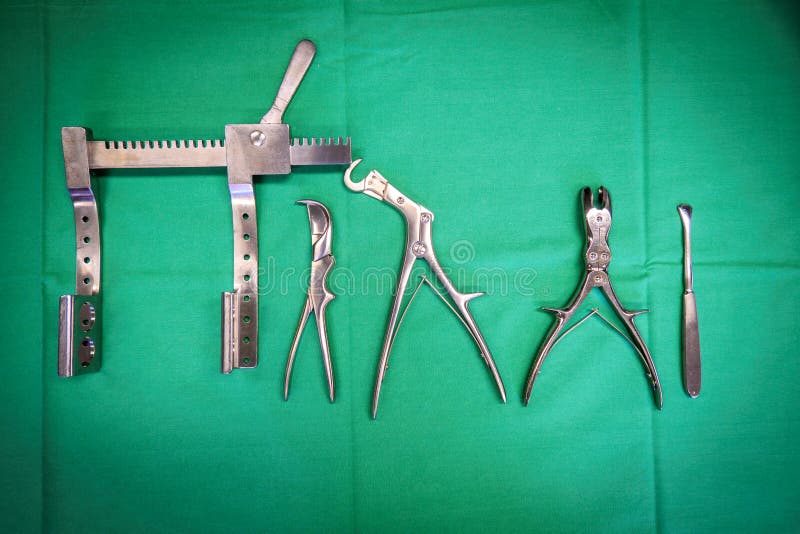Surgical Rib Instruments Lie on a Green Surgical Cloth Stock Photo ...