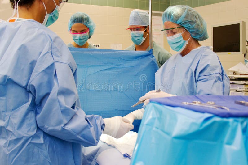 Surgical Team Conducting Surgery Stock Image - Image of operation ...
