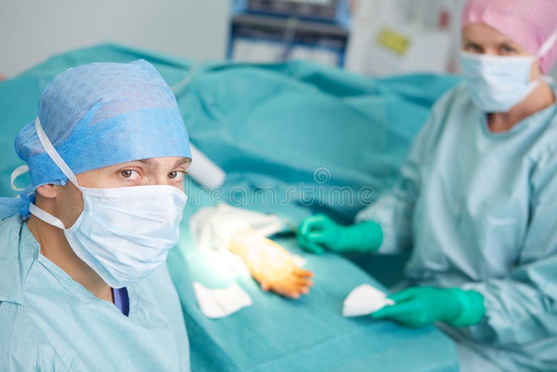 Surgical Team Performing Hand Operation Stock Photo - Image of hand ...
