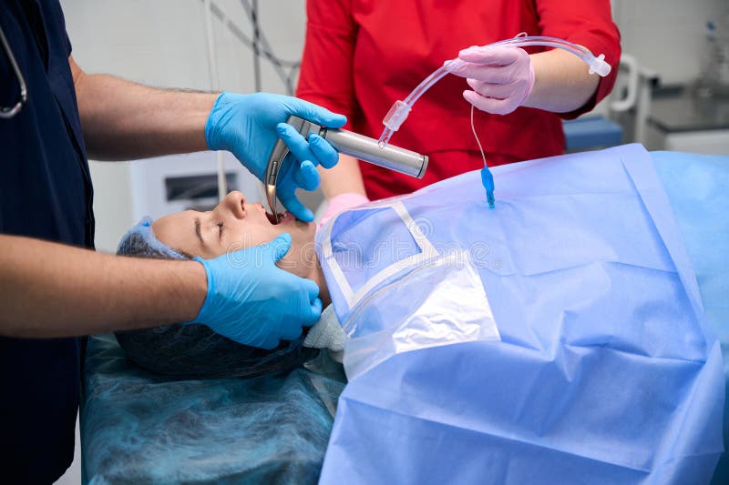 Surgical Team Performing Intubation in Operating Room Stock Photo ...