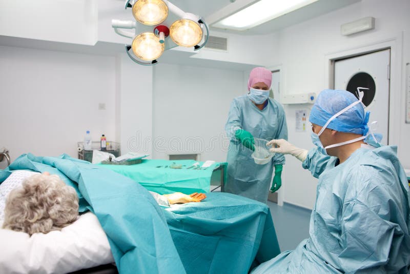 Surgical Team Performing Operation Stock Image - Image of clean, care ...