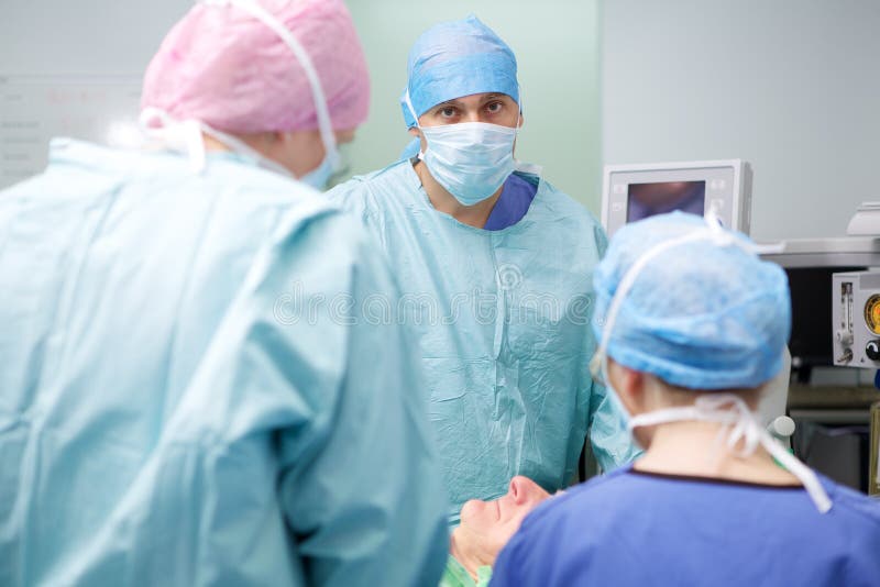 Surgical Team Performing Operation Stock Image - Image of operation ...