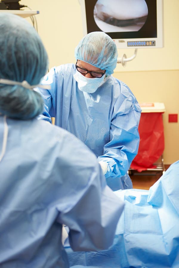 Surgical Team Working in Operating Theatre Stock Image - Image of mask ...