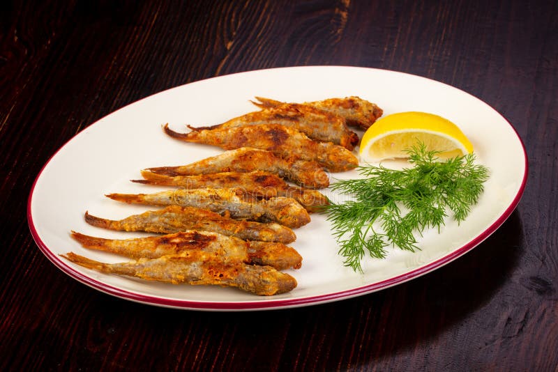 Surmullet fish with lemon stock image. Image of meal - 119977233