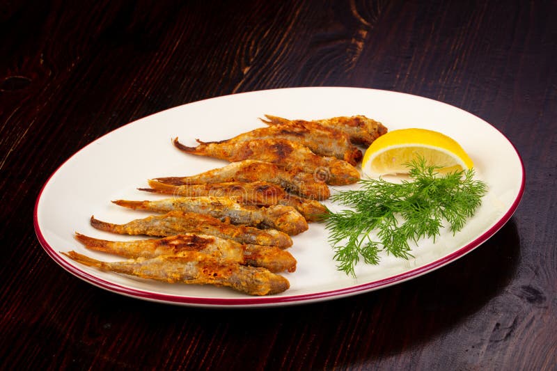 Surmullet fish with lemon stock image. Image of food - 120742433