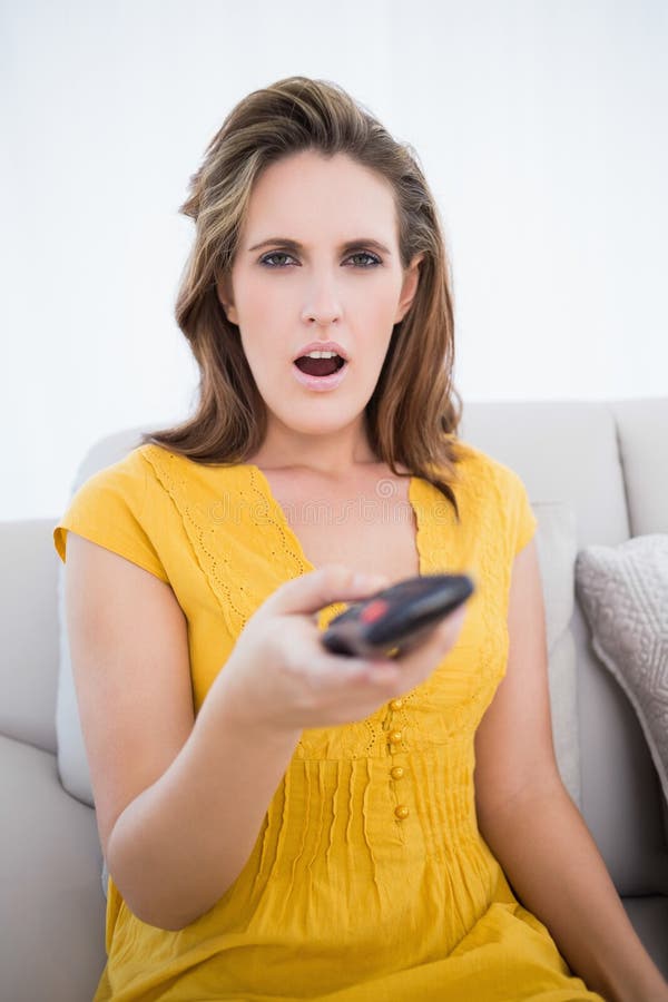 Surpised Woman Holding Remote Control Stock Image - Image of spare ...