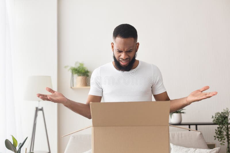 Surprised African American Man Opened Box and Spreads His Hands Stock ...