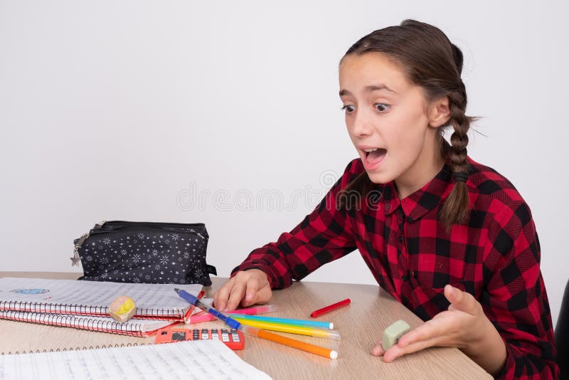 Surprised and Angry Girl Doing the Homework of the School Stock Photo ...