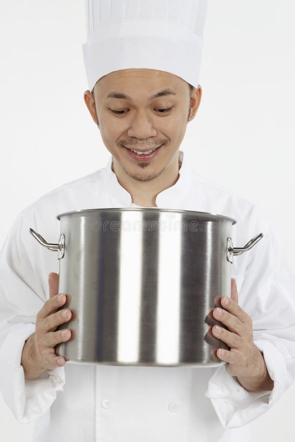 Surprised Asian Chef Looking into Stew Pot. Conceptual Image Stock ...