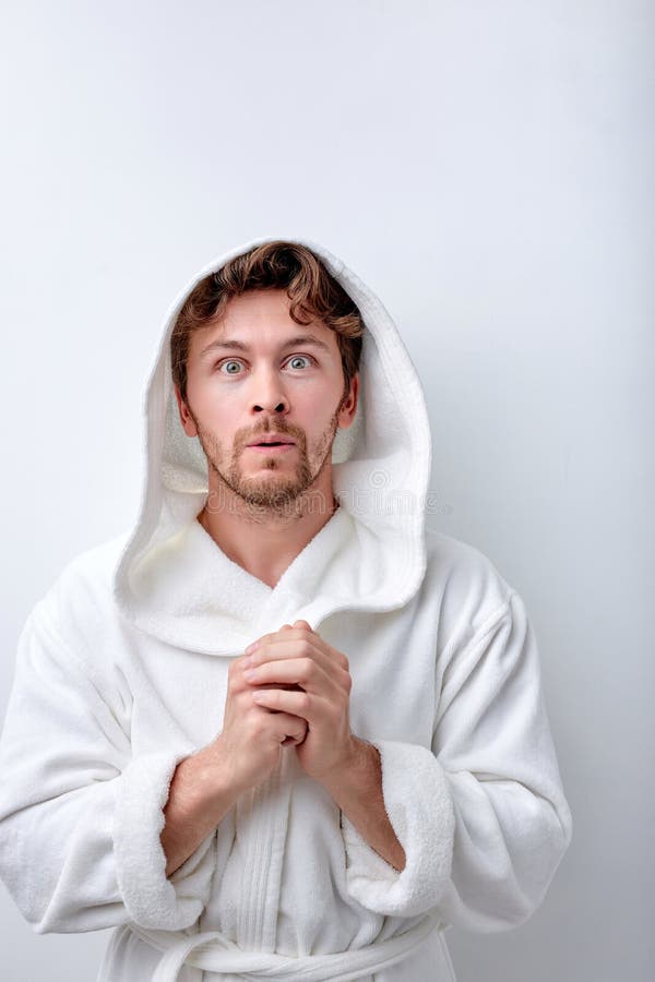 Surprised Bearded Guy in Bathrobe Keep Hands Together Looking at Camera ...