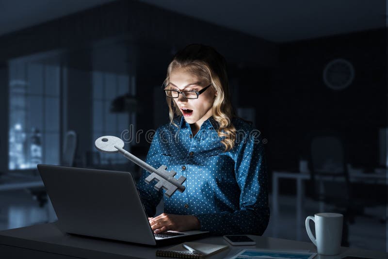 Attractive Blonde Wearing Glasses in Dark Office Using Laptop. M Stock ... Attractive Blonde Wearing Glasses in Dark Office Using Laptop. M Stock ...