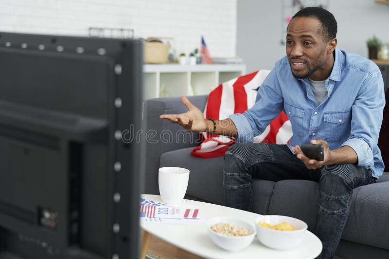 Surprised Man in Front of TV Stock Image - Image of greeting, flag ...