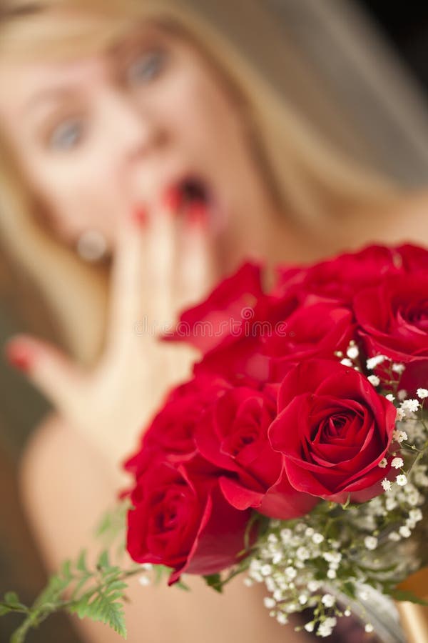 Surprised Blonde Woman Accepts Gift of Red Roses Stock Image - Image of ...