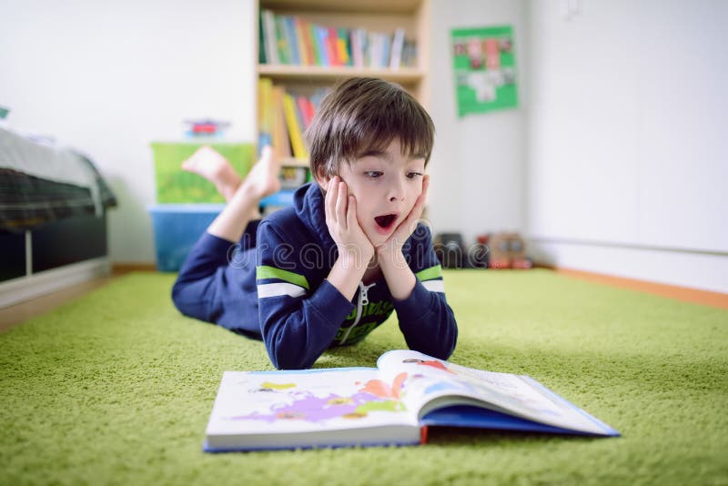 Surprised Boy is Discovering Something from the Book Stock Photo ... Surprised Boy is Discovering Something from the Book Stock Photo ...