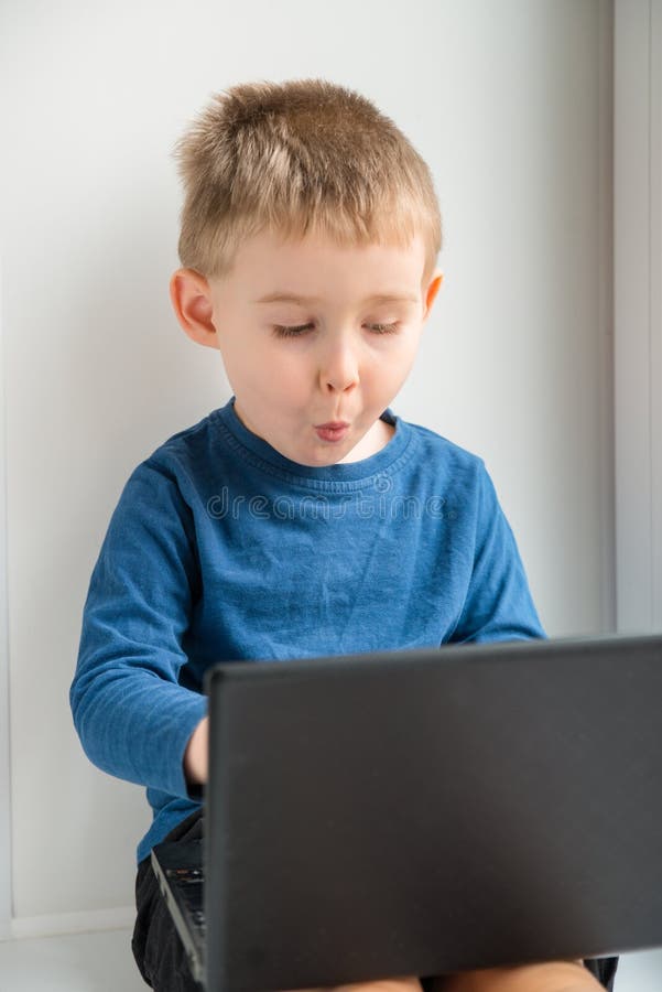 Surprised Boy Looking on the Laptop Screen Stock Photo - Image of ...
