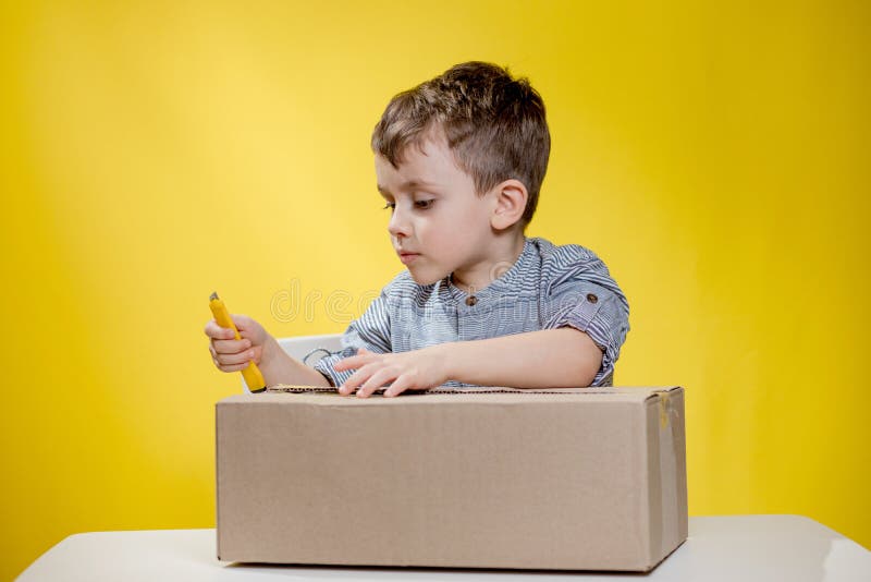 Surprised Boy Looking Opening a Box and Gasping in Surprise Seeing the ...