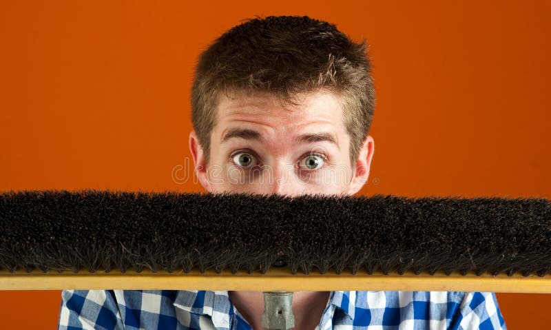 Surprised Caucasian Male Hiding Broom Stock Photos - Free & Royalty ...