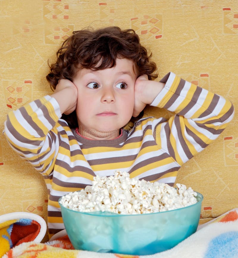 Surprised Child with a Bowl Full of Popcorn Stock Photo - Image of ...