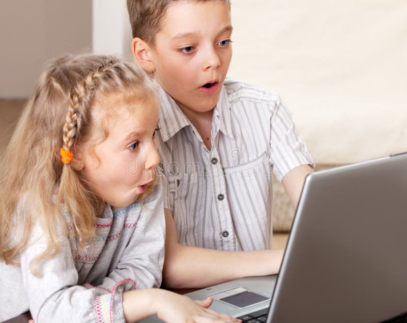 Focused Kids Looking at Laptop Computer Stock Photo - Image of concept ...