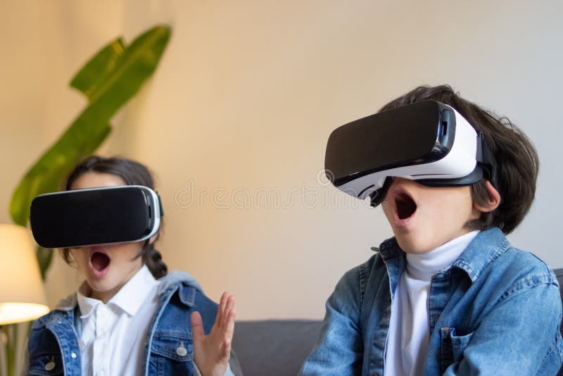 Surprised Children in Virtual Reality Glasses Testing New Application ...