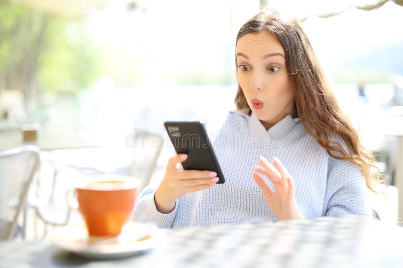 Surprised Coffee Shop Customer Checking Phone Stock Photo - Image of ...