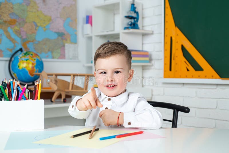 Surprised Cute Child, Writing in Notebook Using Pencil. Stock Image ...