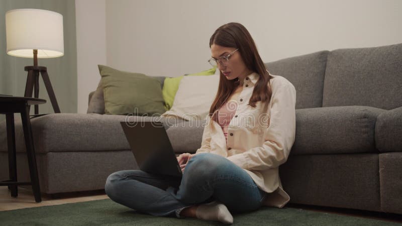 A Surprised Girl Types a Text on the Computer and Looks at the Screen ...