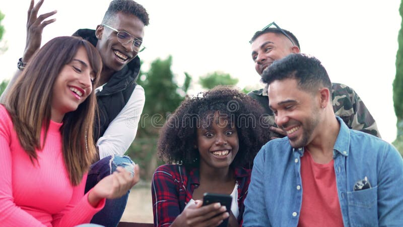 Surprised Group of Friends Laughing while Looking at Mobile Stock ...