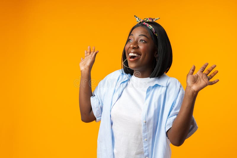 Surprised Happy Young African Woman Express Shock Against Yellow ... Surprised Happy Young African Woman Express Shock Against Yellow ...
