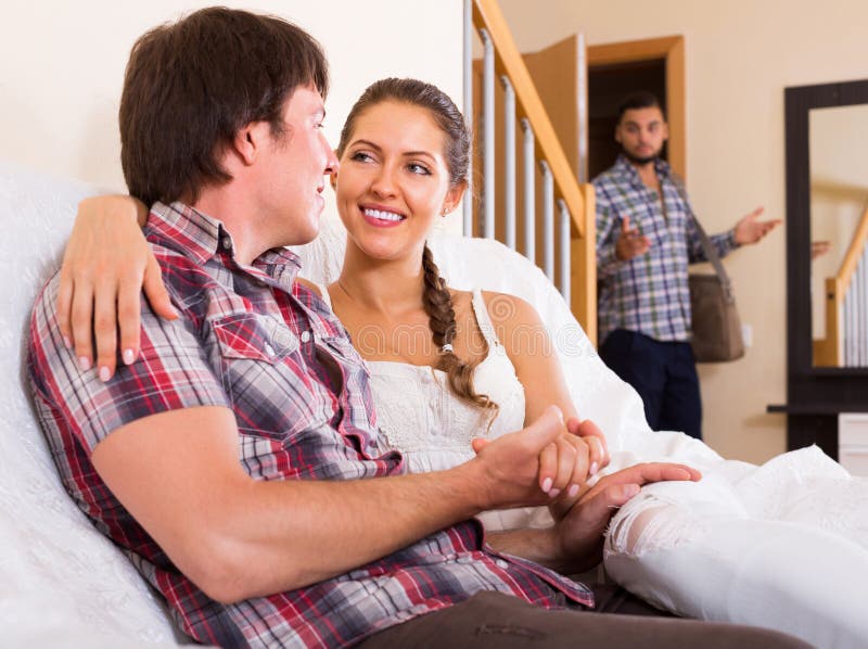 Surprised Husband Hiding Bouquet of Flower Behind His Back before ...