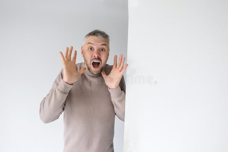 A Surprised Man with His Mouth Open and Hands Raised in Shock. he S ...