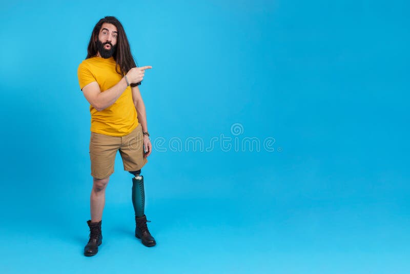 Surprised Man with Prosthetic Leg Pointing To the Side Stock Photo ...