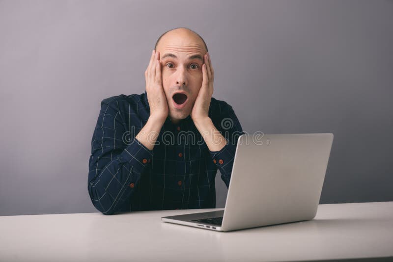 Surprised Man Sits Behind a Laptop Stock Image - Image of male, private ...