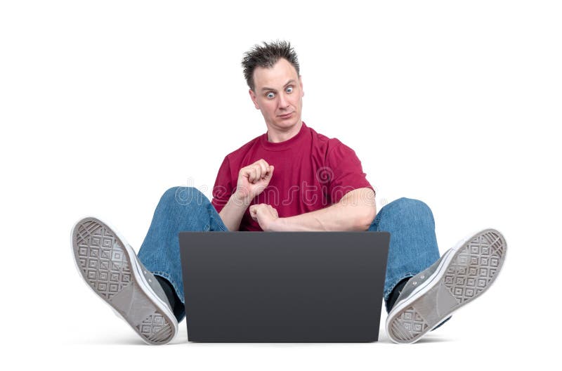Sad Man is Sitting on the Floor in Front of a Laptop, Grabbing His Head ...